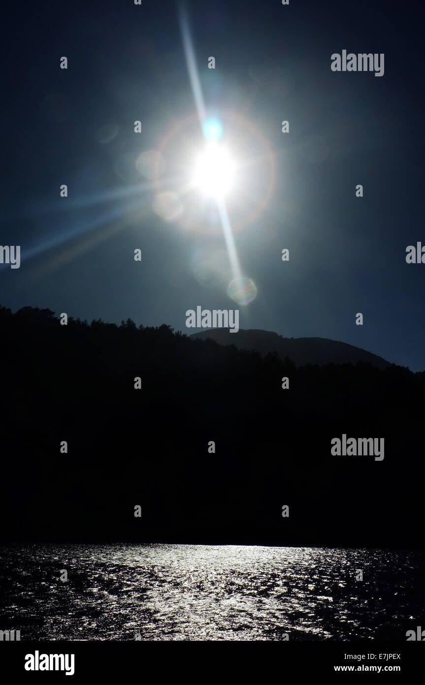 Sunlight sparkling above sea Stock Photo - Alamy