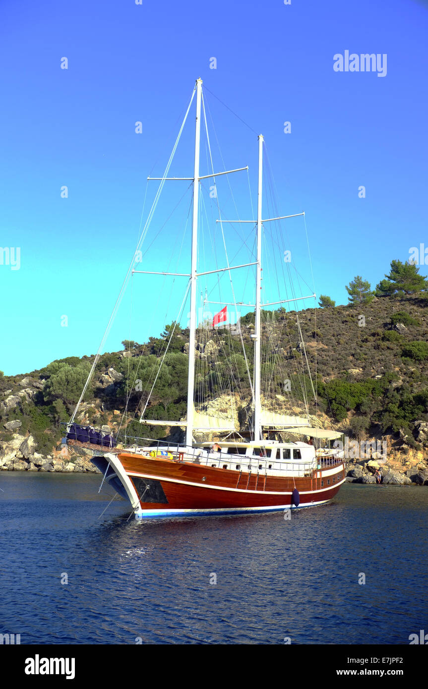 Sailing boat anchored in bay Stock Photo - Alamy