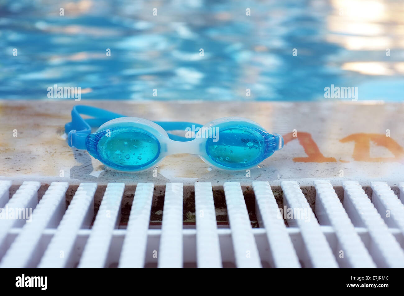 Blue goggles by the pool Stock Photo - Alamy