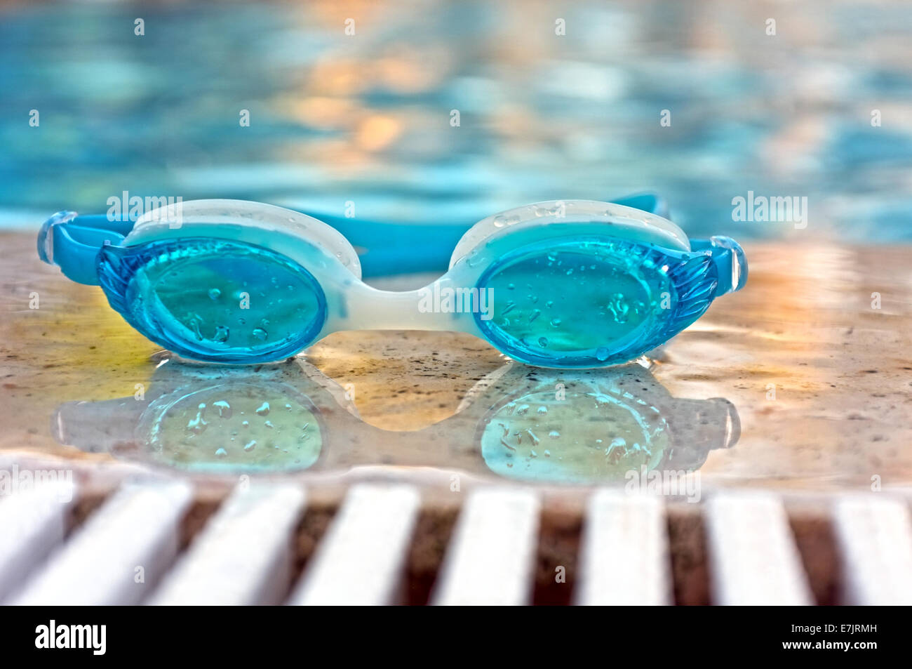 Blue goggles by the pool Stock Photo - Alamy