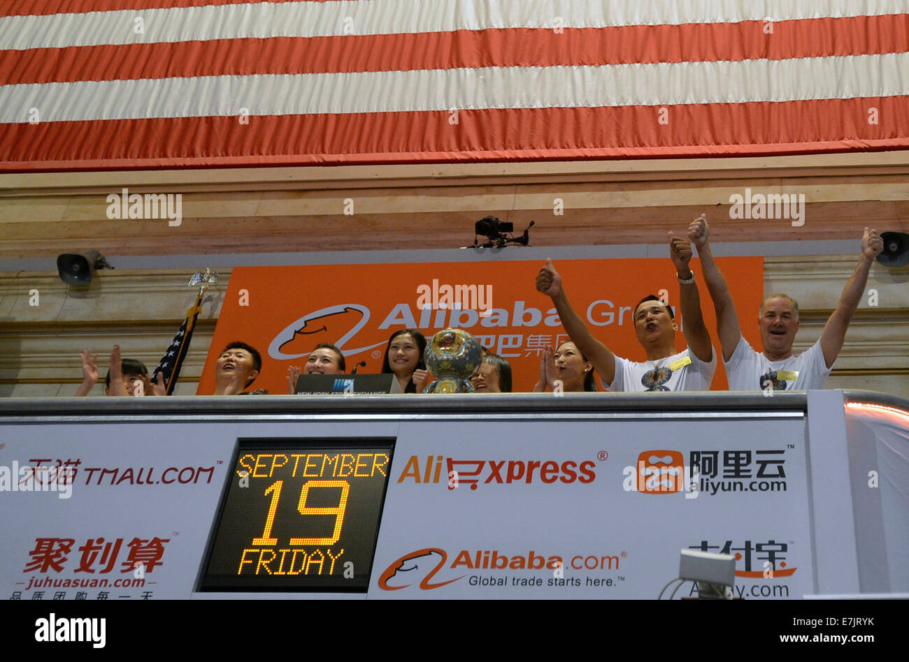 New York, USA. 19th Sep, 2014. Eight Alibaba representatives ring the ...