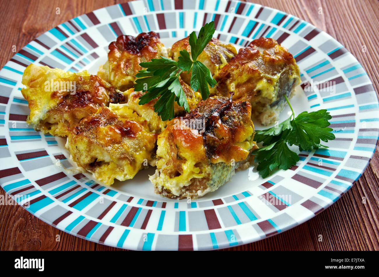 Fish dish - roasted fish close up Stock Photo - Alamy