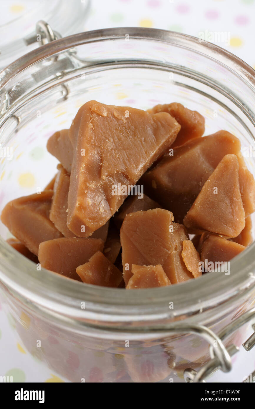 Old fashioned toffee pieces in a a sweet jar Stock Photo - Alamy