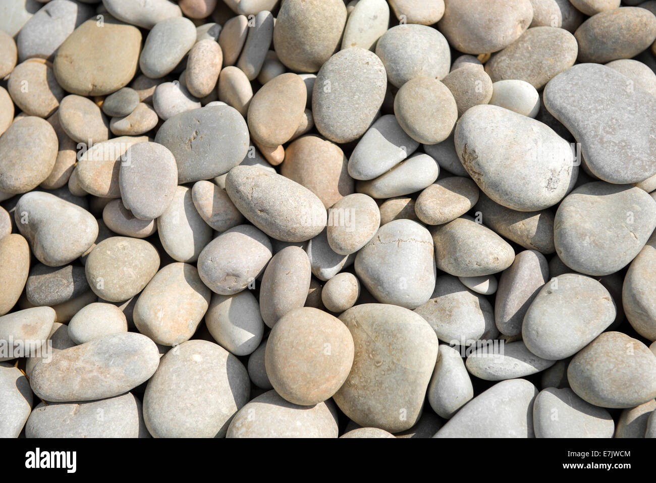 Sea stones background Stock Photo - Alamy