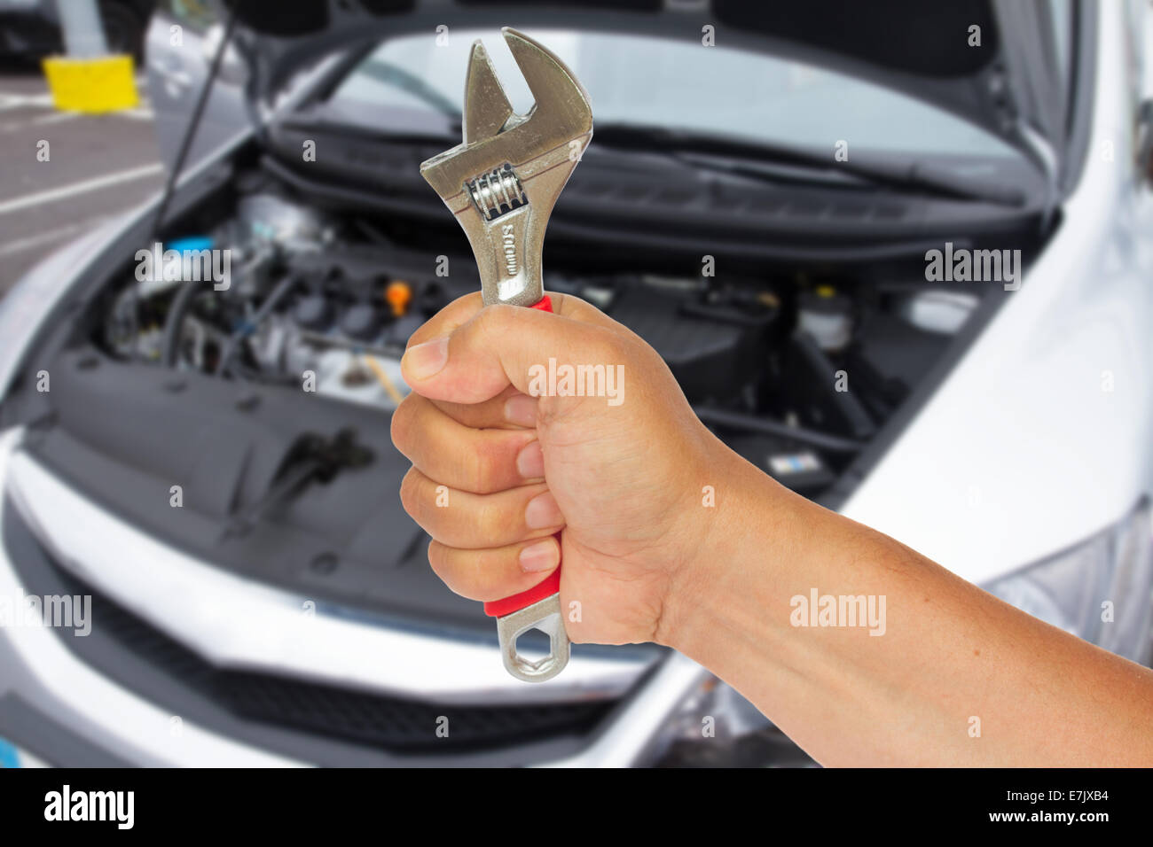 Auto mechanic hand with wrench Stock Photo - Alamy