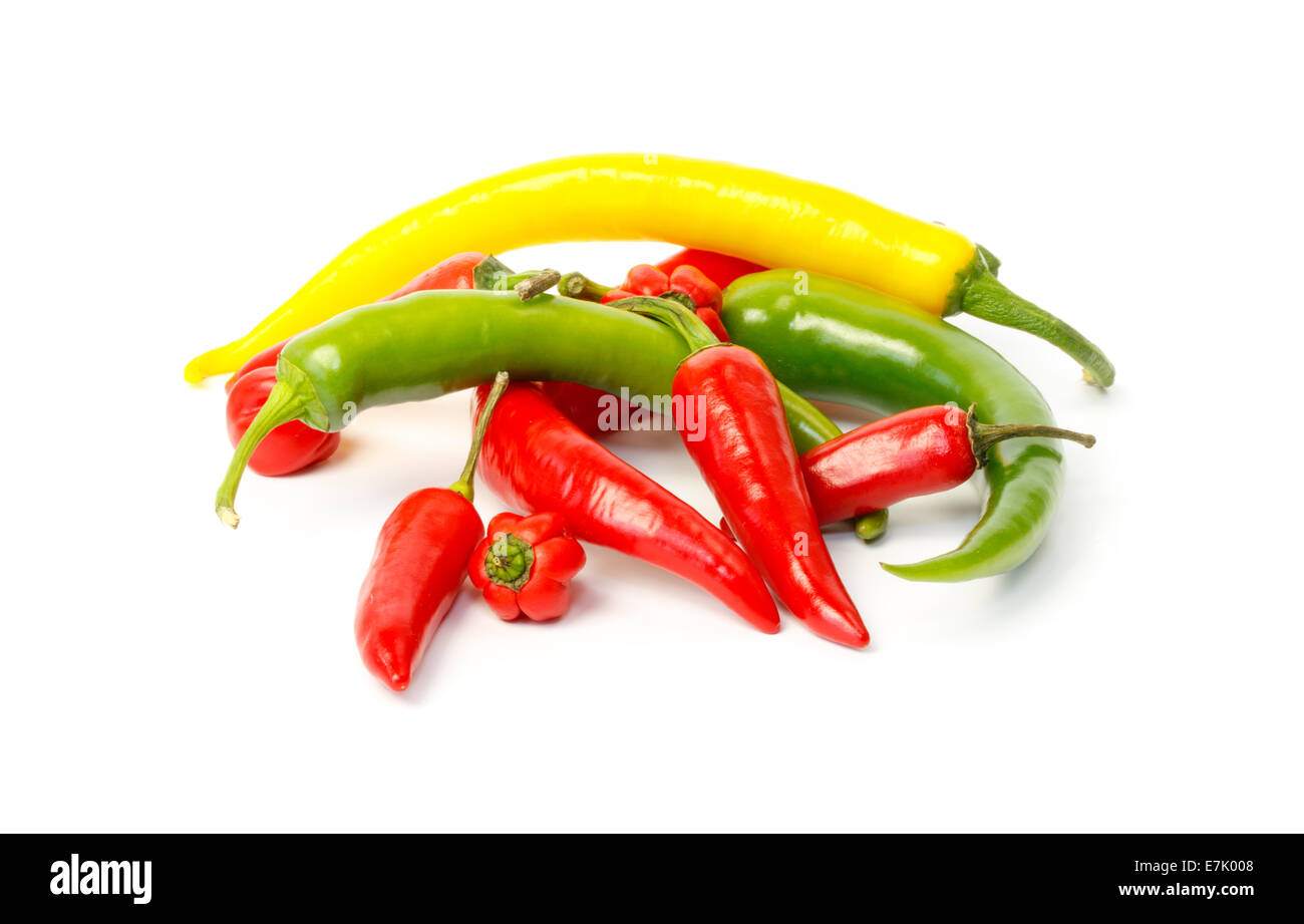 Group of colored hot peppers against white background Stock Photo - Alamy