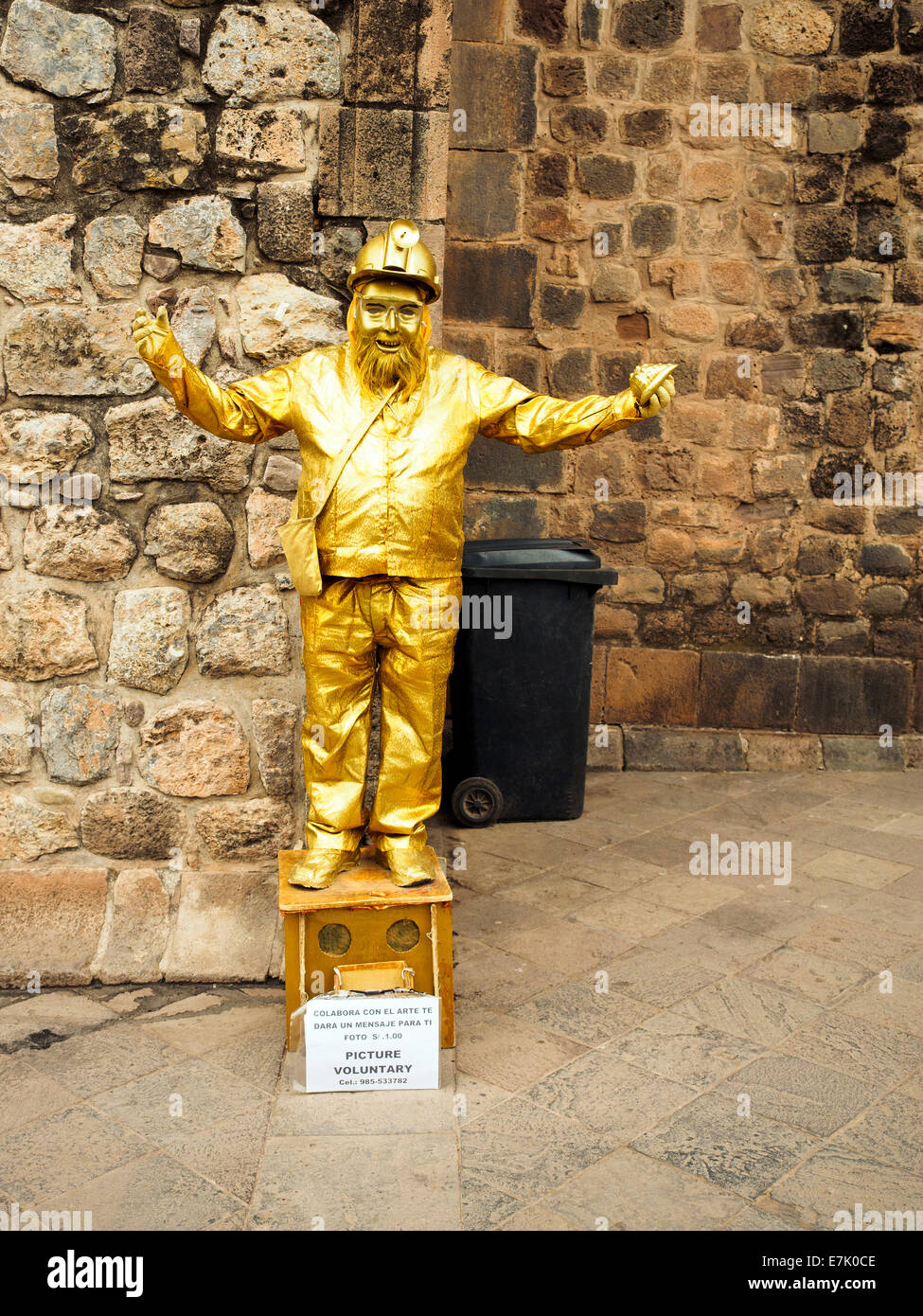 Human statue street performer in golden clothes - Cusco, Peru Stock ...