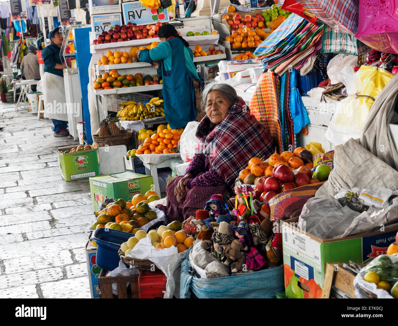 Local woman selling fruits inside San Pedro market - Cusco, Peru Stock ...