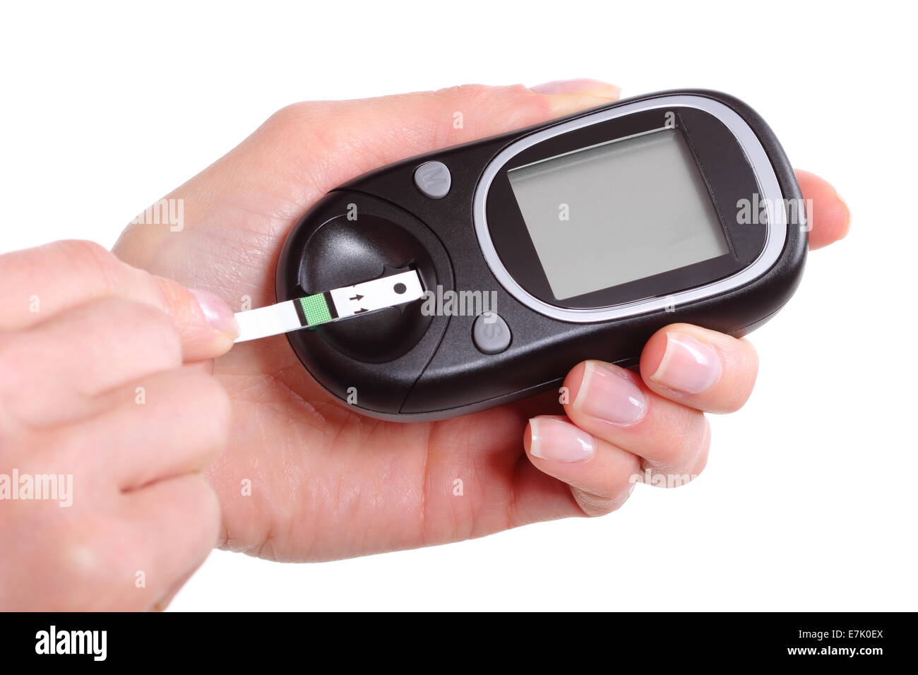 Closeup of strip for glucose testing and glucose meter, measuring sugar ...