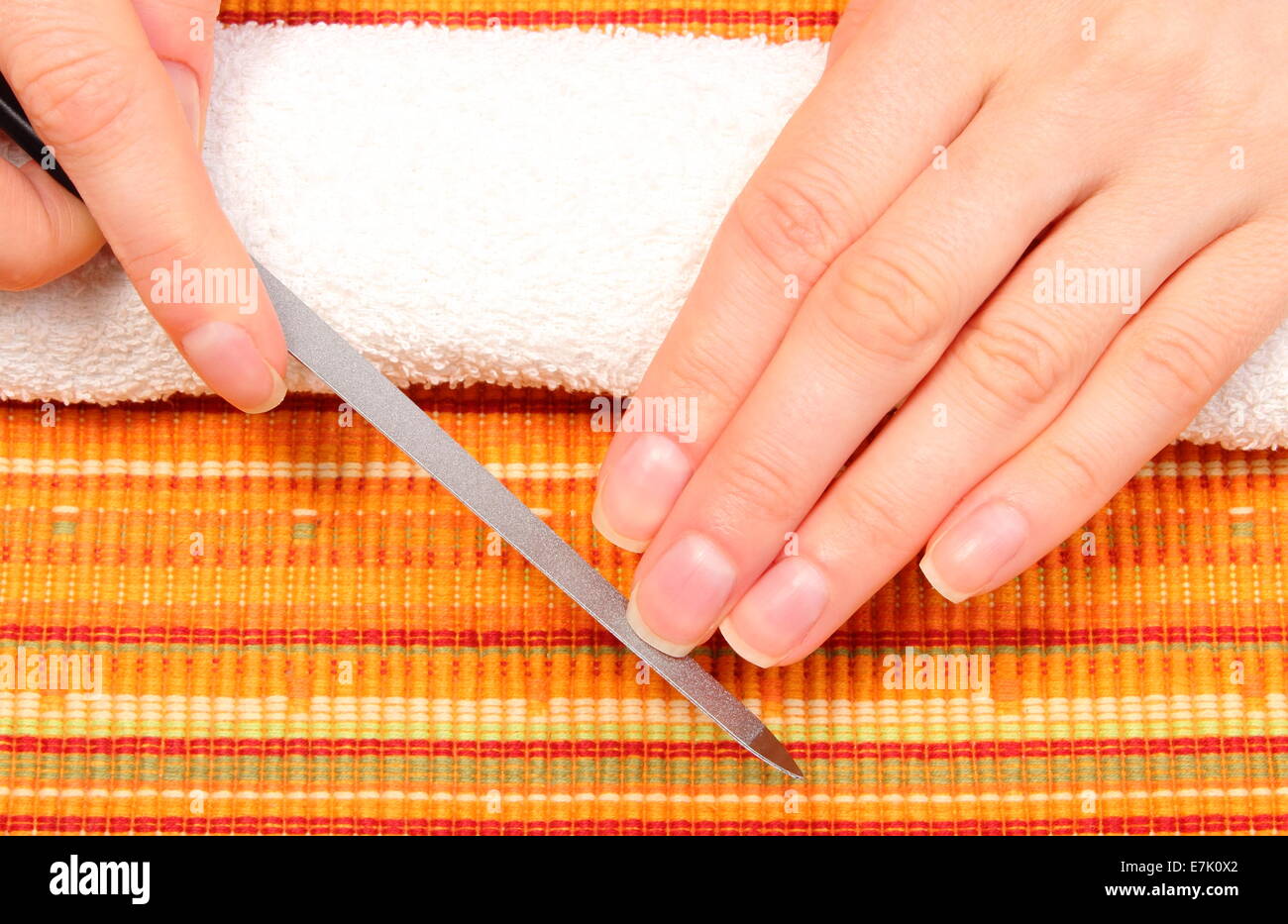 Woman polishing nails hi-res stock photography and images - Alamy
