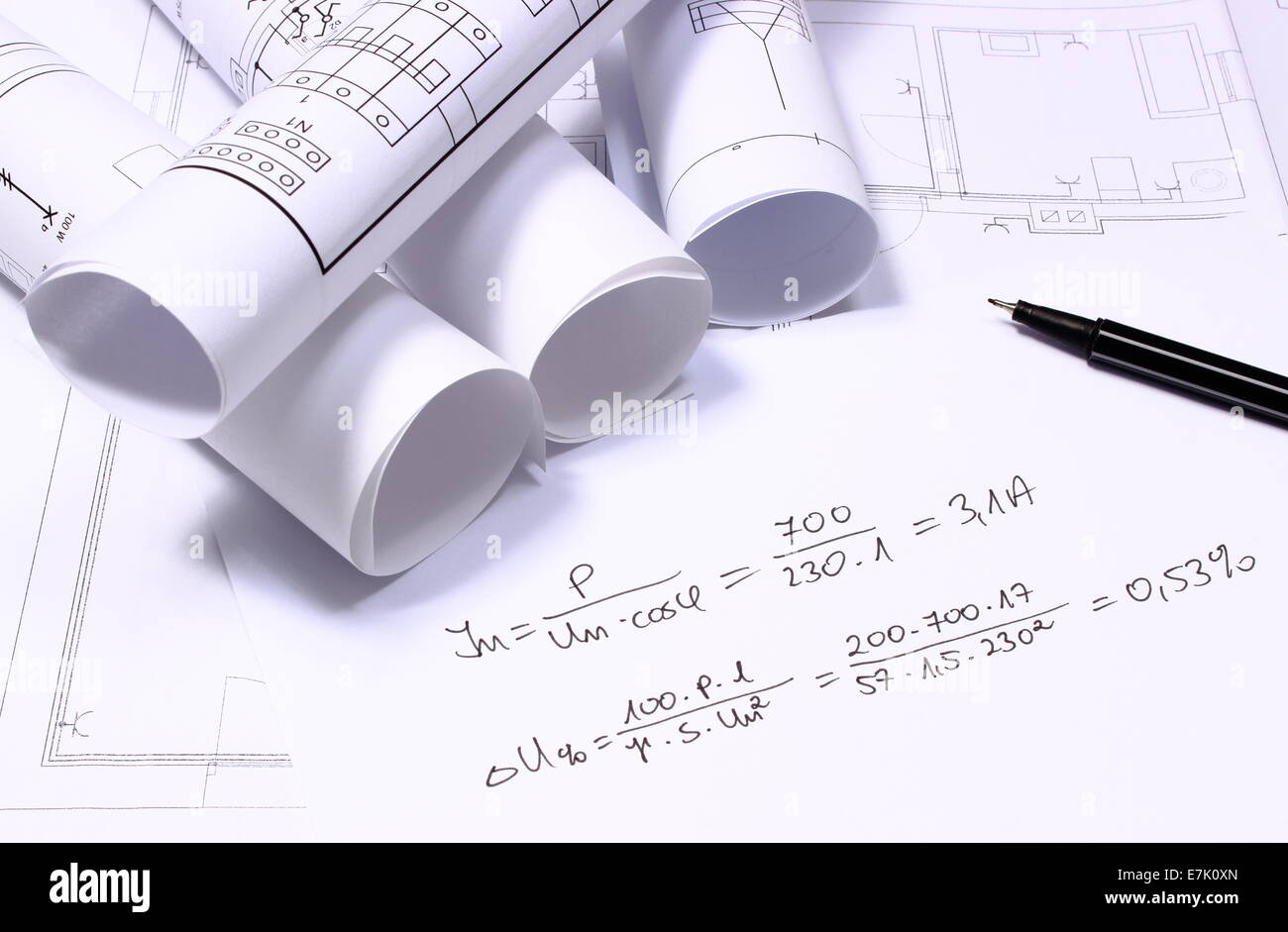 Rolled electrical diagrams and mathematical calculations for project ...