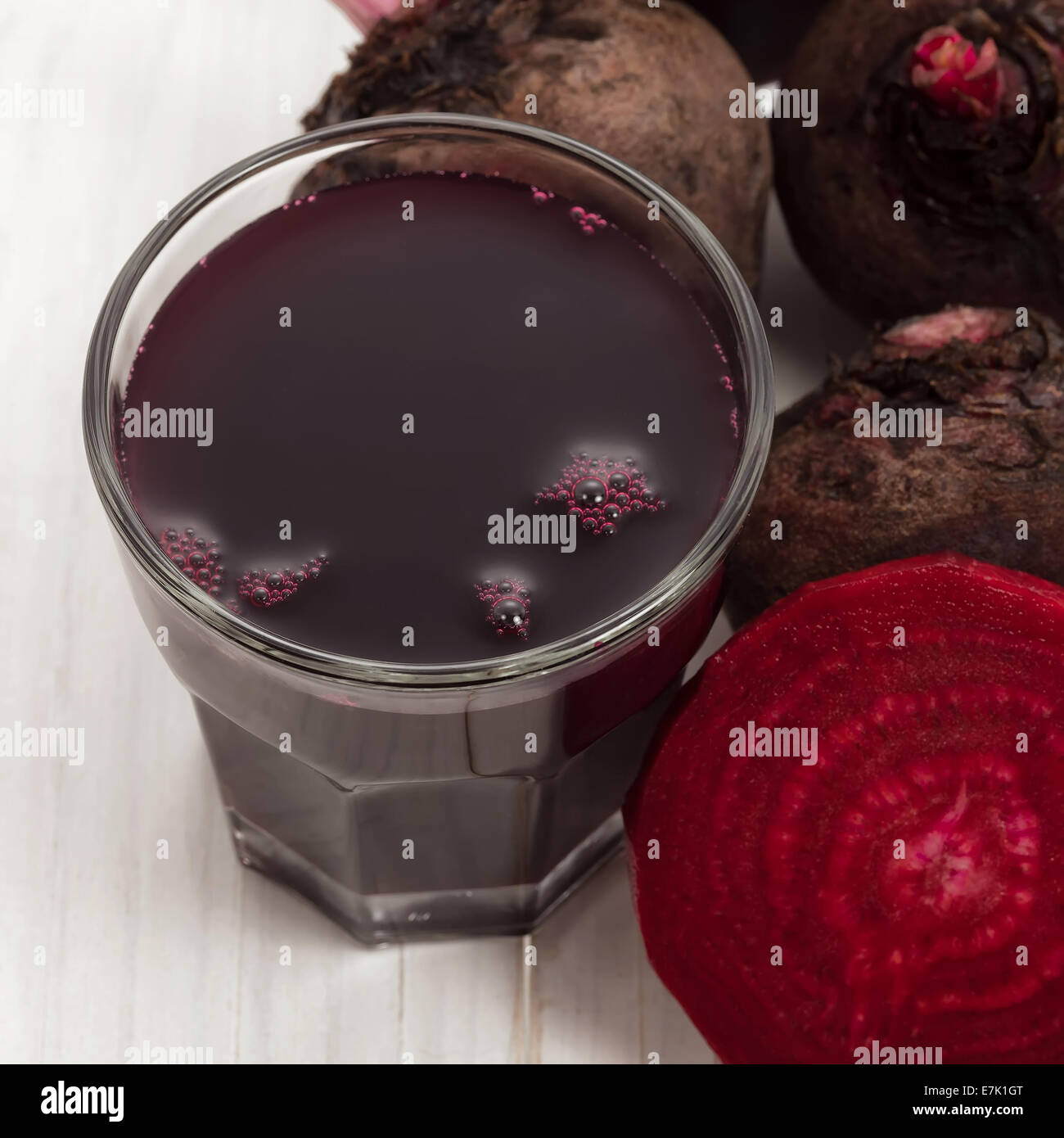 Beetroot juice in glass on white wood Stock Photo - Alamy