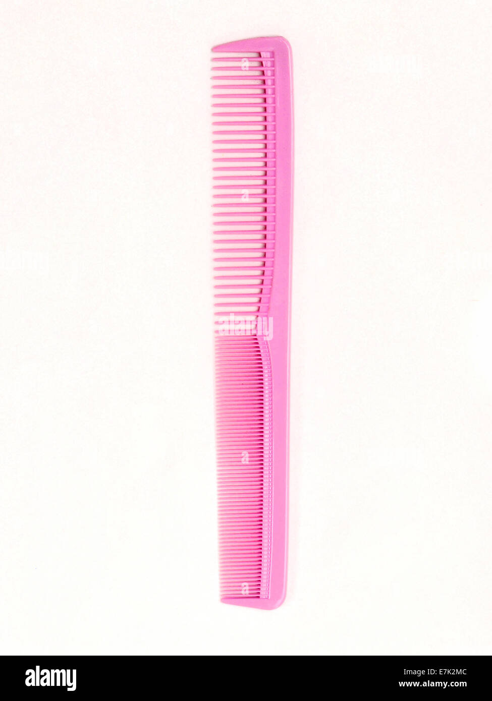 Pink finishing hair comb Stock Photo - Alamy