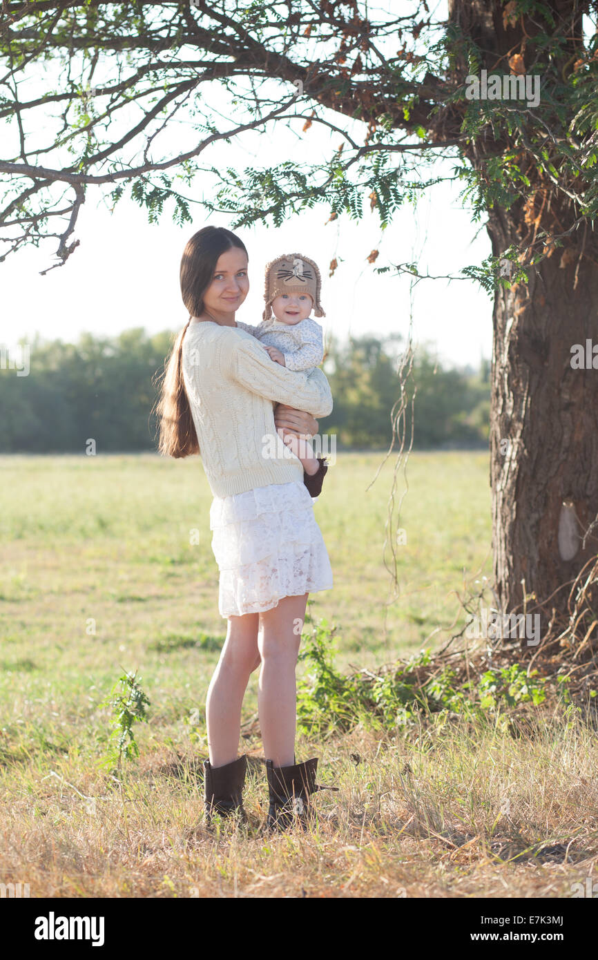 baby and mother strolling on suburban landscape Stock Photo - Alamy