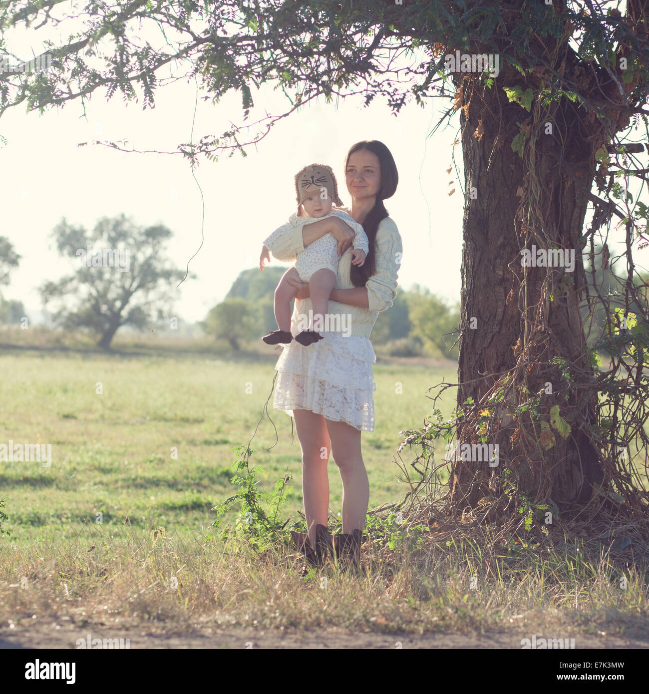 baby and mother strolling on suburban landscape Stock Photo - Alamy
