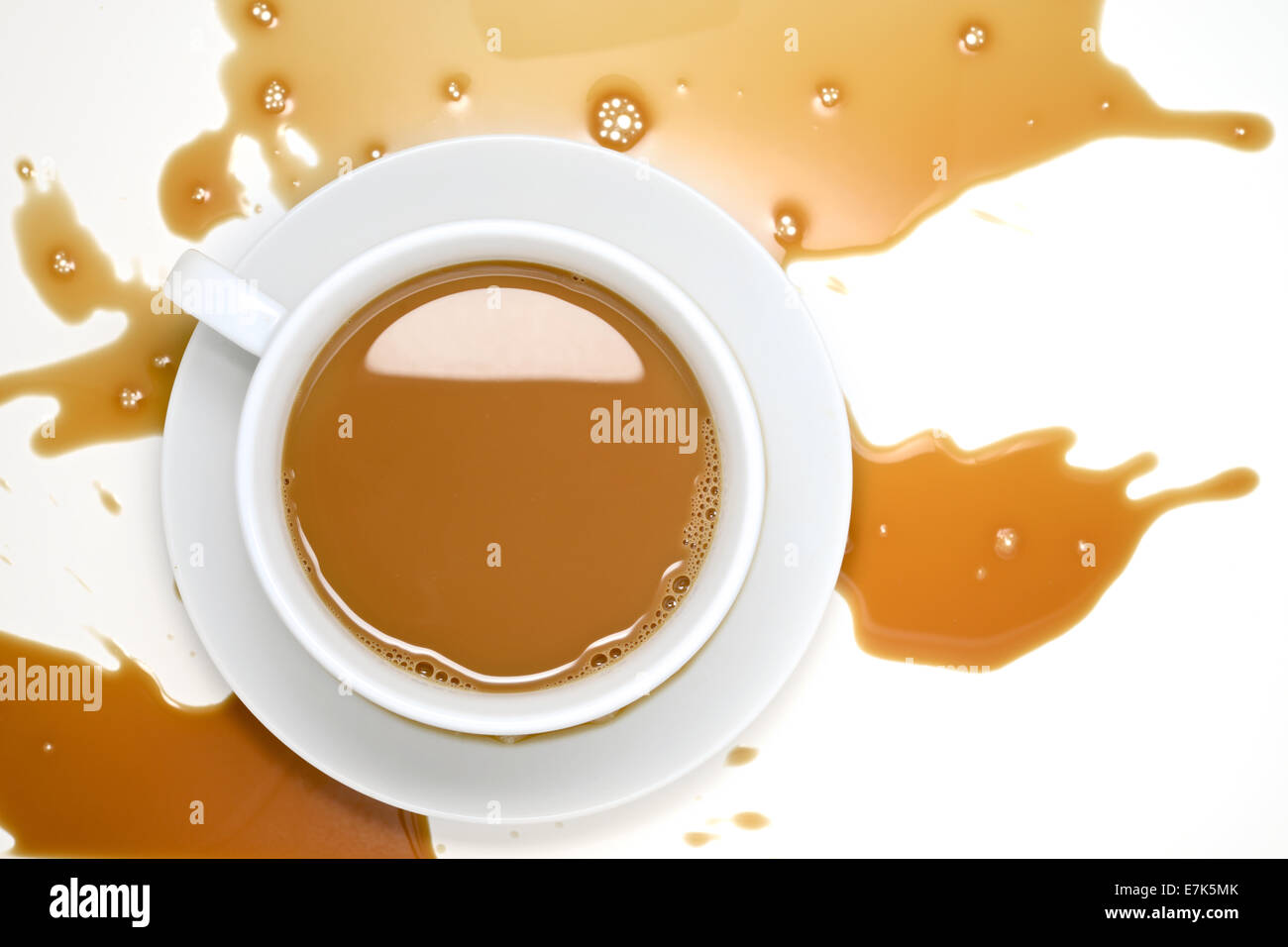 Spilled Coffee on White Desk Stock Photo - Alamy
