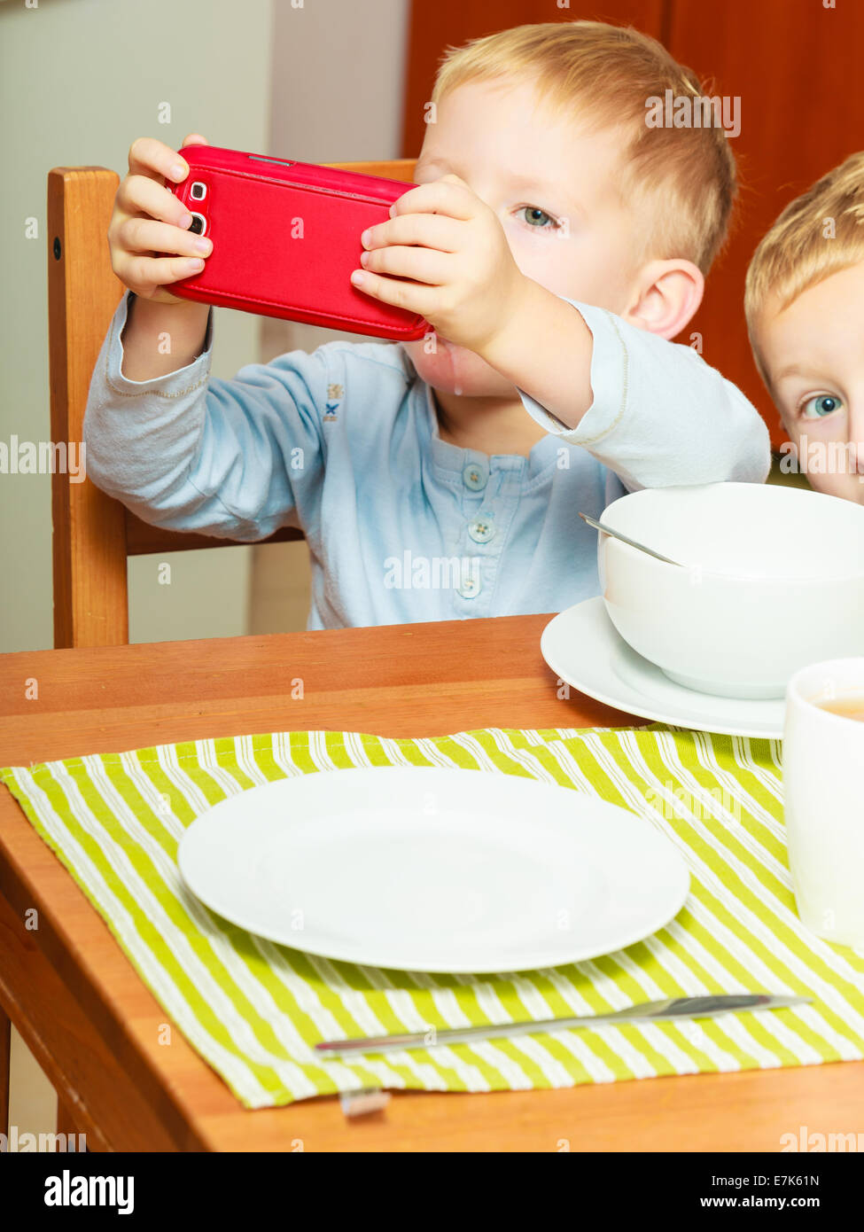Technology generation. Happy childhood. Little boy child dirty mouth ...