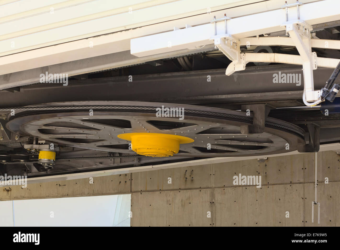 A wheel with cables of the TeleferiQo ropeway at the downhill station ...