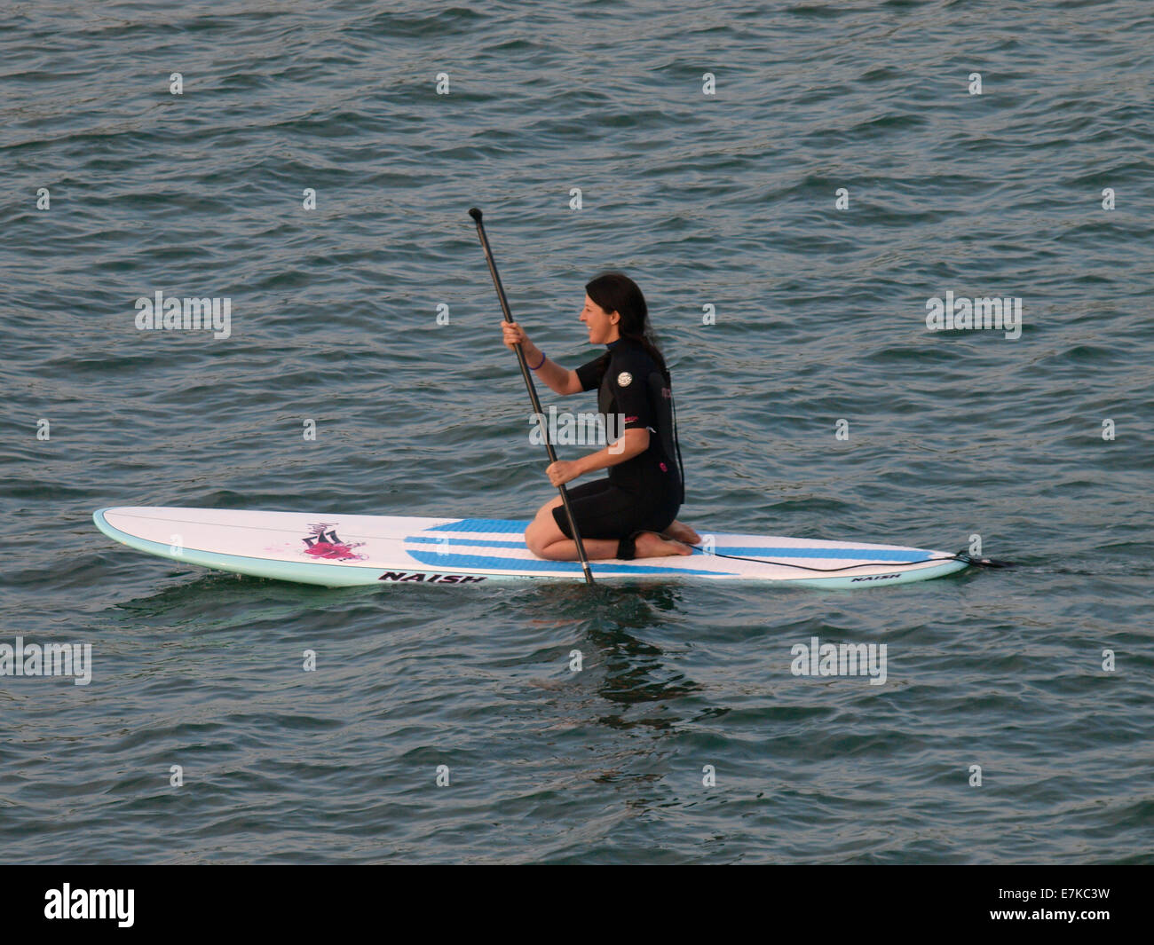 Young 20s on paddle board hi-res stock photography and images - Alamy