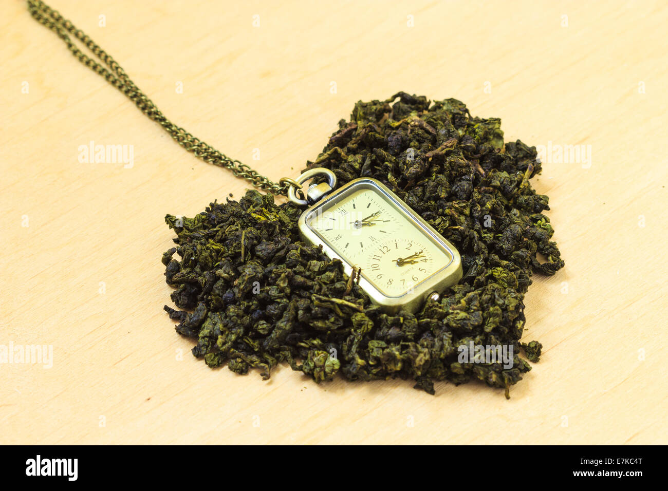 Diet healthcare tea time concept. Green tea heart shaped on wooden ...