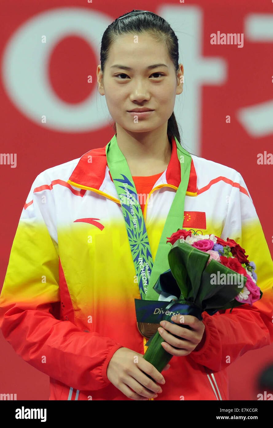 Incheon, South Korea. 20th Sep, 2014. Wei Hong of China poses on the podium during the awarding ...