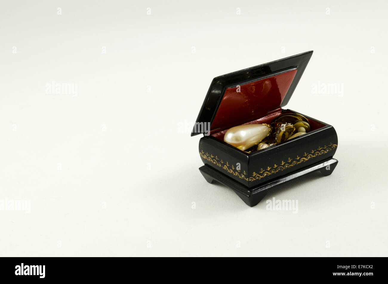 A little treasure Chest with some jewels isolated on white Stock Photo ...