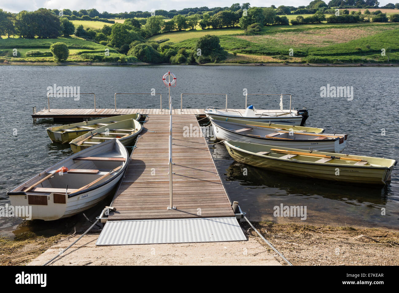 Rowing boats tied to landing stage on Clatworthy reservoir Stock Photo ...