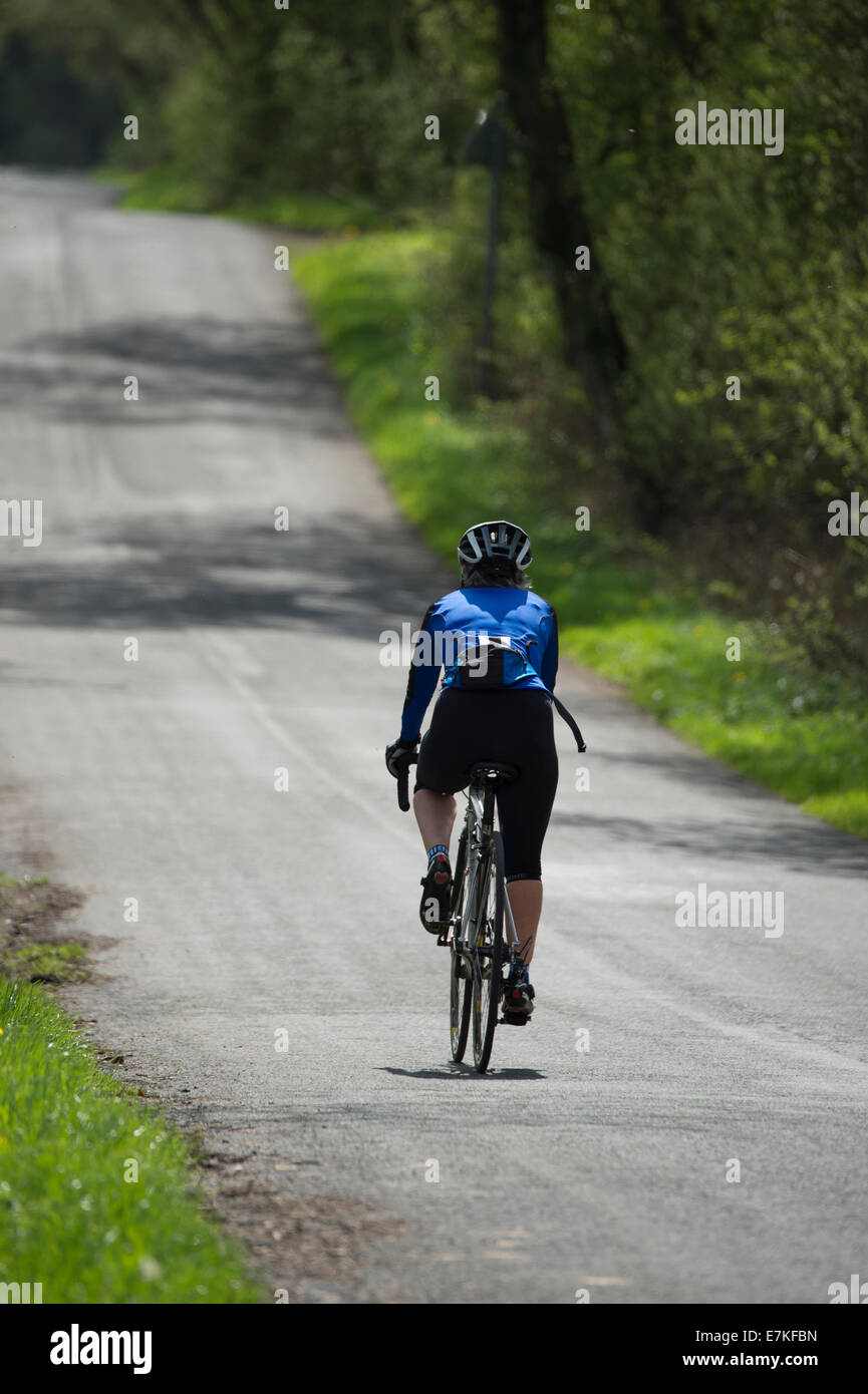 Woman freewheeling bike hi-res stock photography and images - Alamy