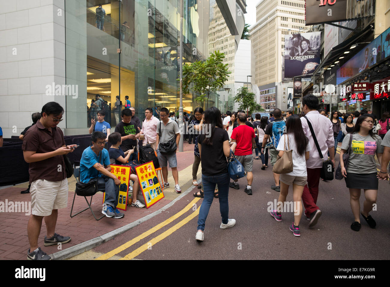 Shoppers outside the Apple Store. Some are reselling iPhones Stock ...