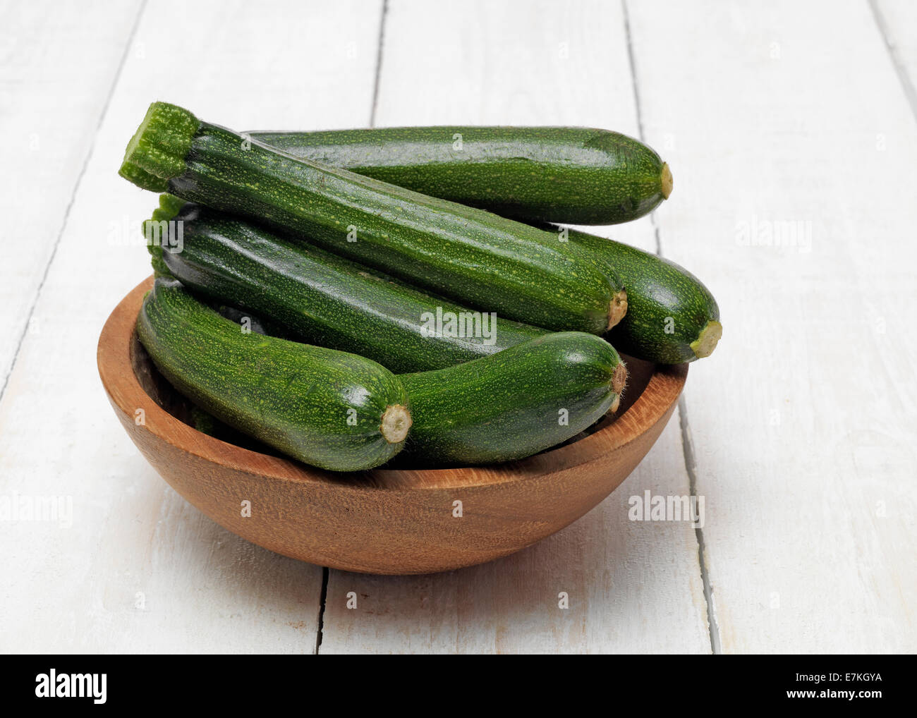 Fresh Courgettes on table top Stock Photo - Alamy