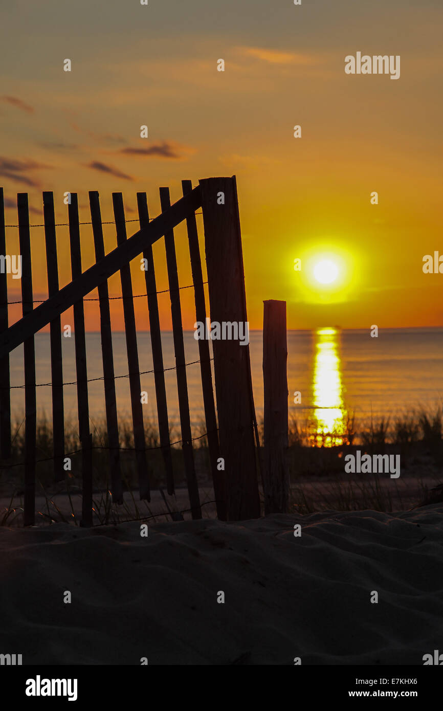 Wooden fence with sunset sky in Cape Cod Stock Photo - Alamy