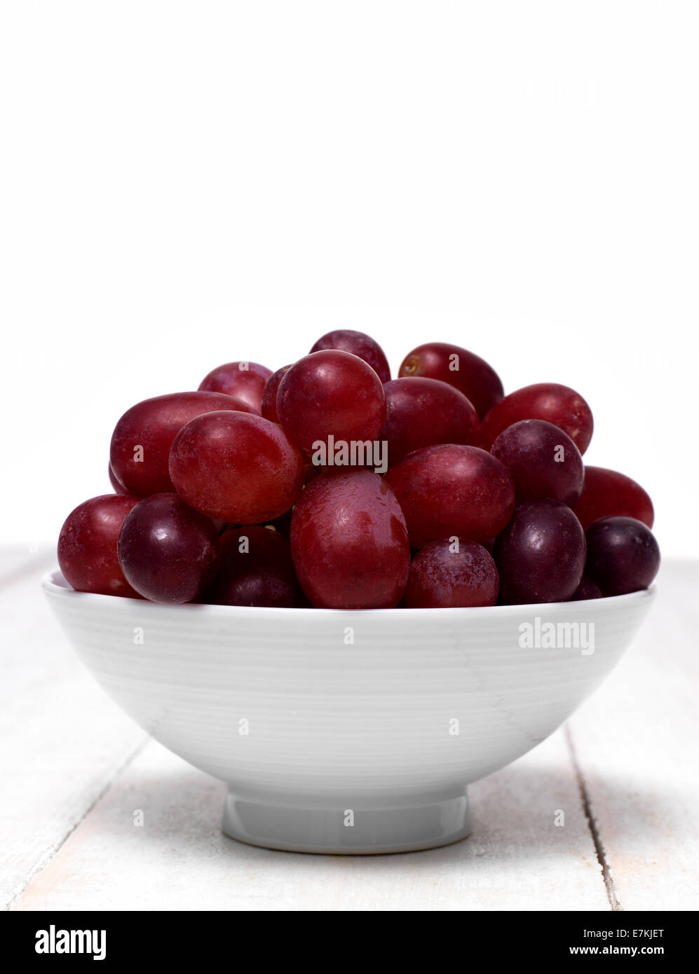 Red Grapes in a small bowl Stock Photo - Alamy