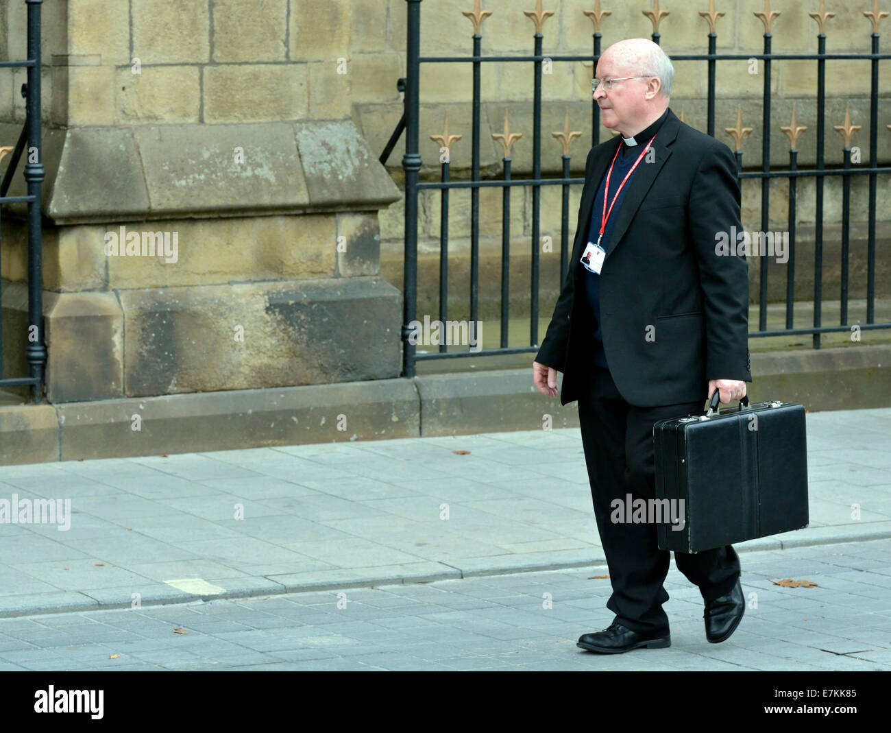 Salford, UK 20th September 2014 A priest arrives at St John's Roman ...