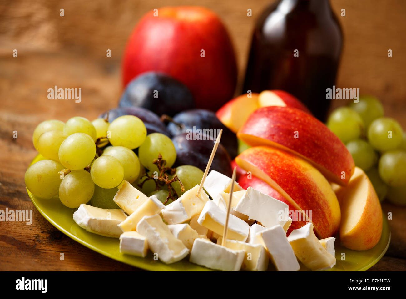 Appetizer mix including cheese, grape, plum and apple Stock Photo - Alamy