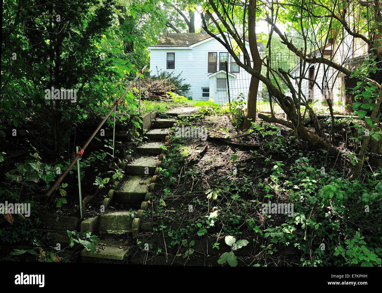Steps leading down and away from backside of house Stock Photo - Alamy