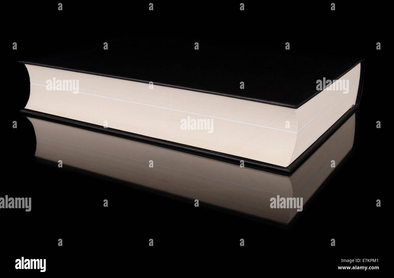 book with reflection over black isolated background Stock Photo - Alamy