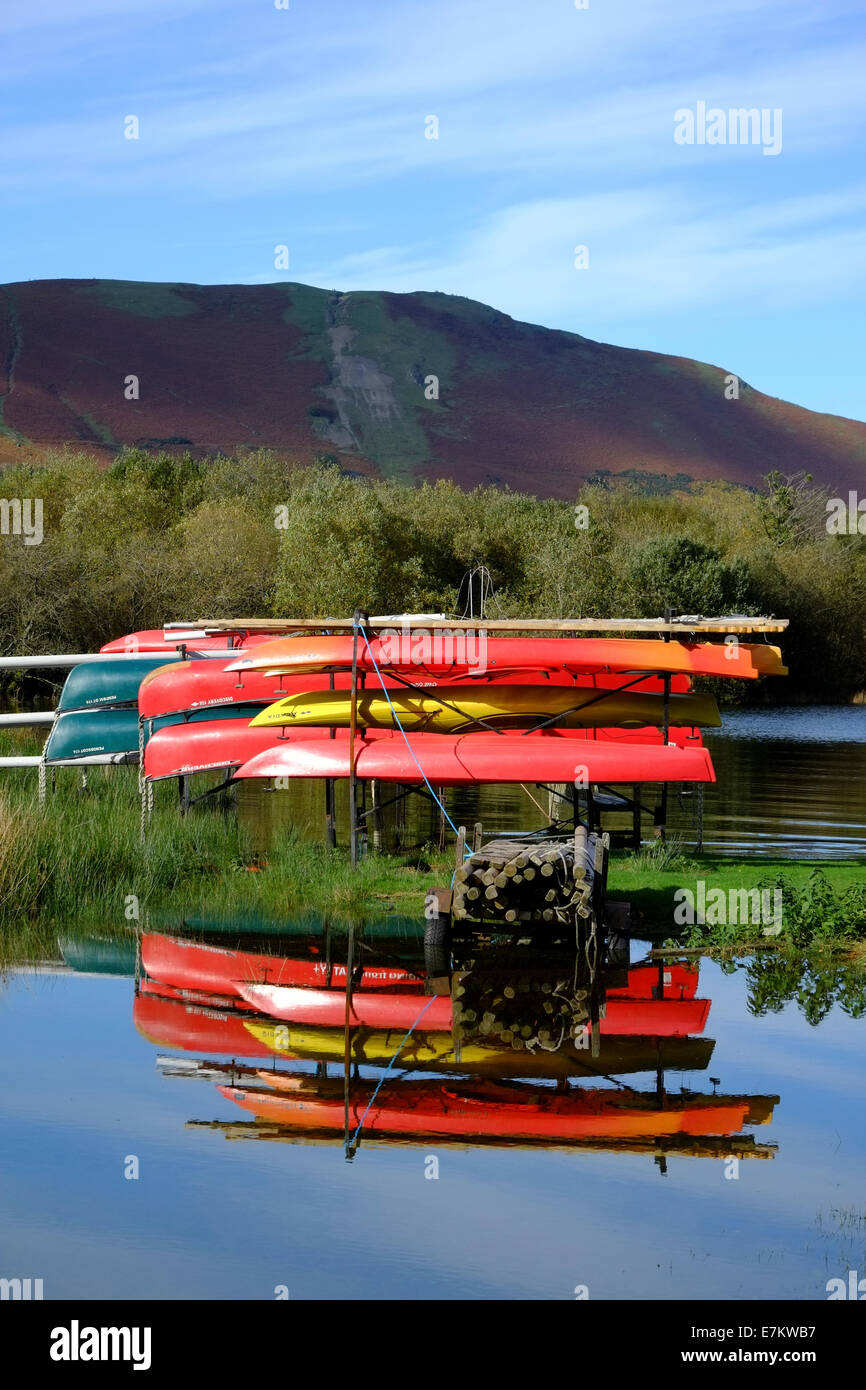 Bright Red Rowing Boats reflected in the water around Derwent Water in ...