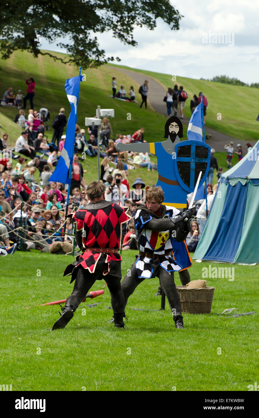 Knights fighting at a medieval jousting tournament at Linlithgow Palace ...