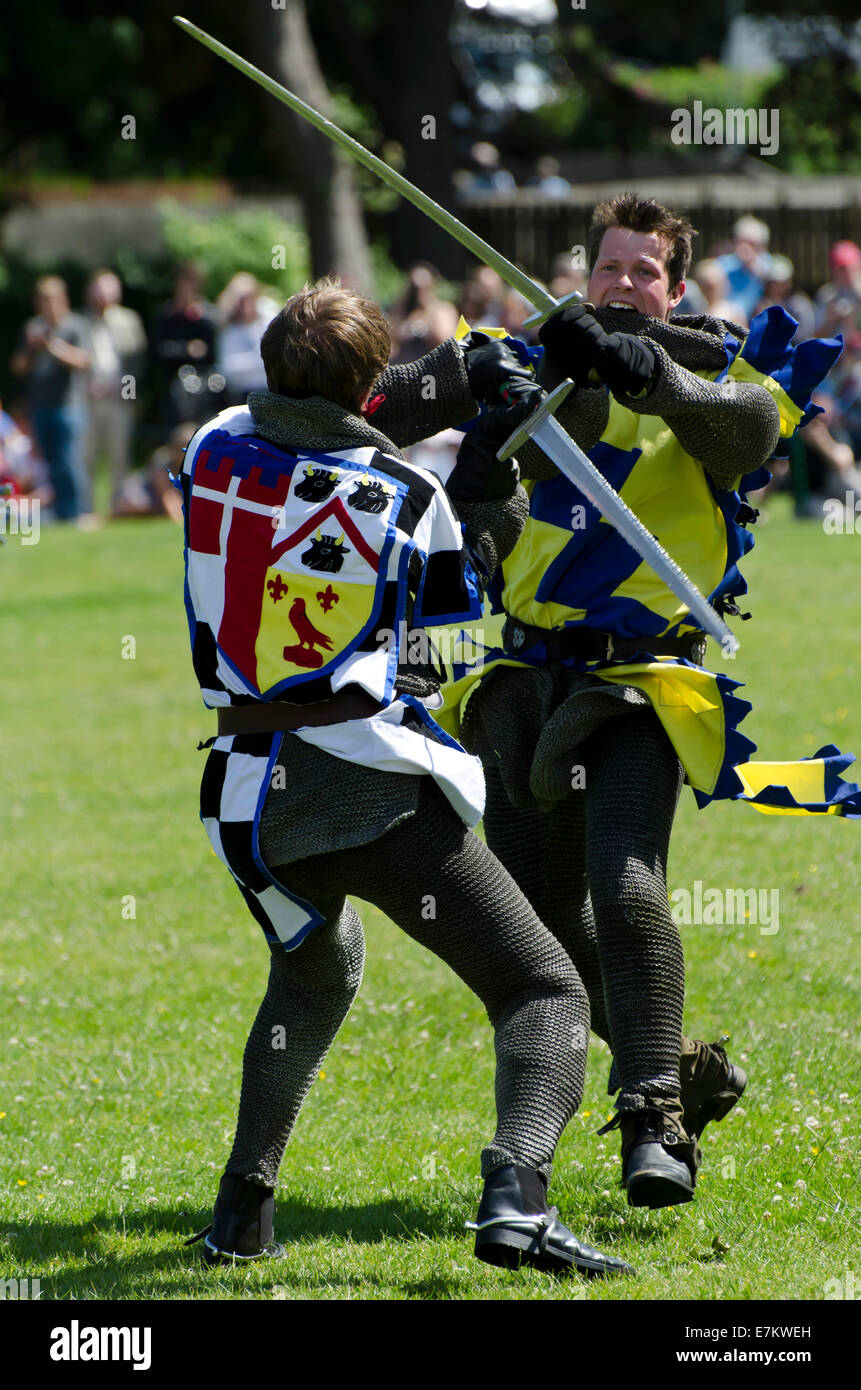 Knights fighting at a medieval jousting tournament at Linlithgow Palace ...