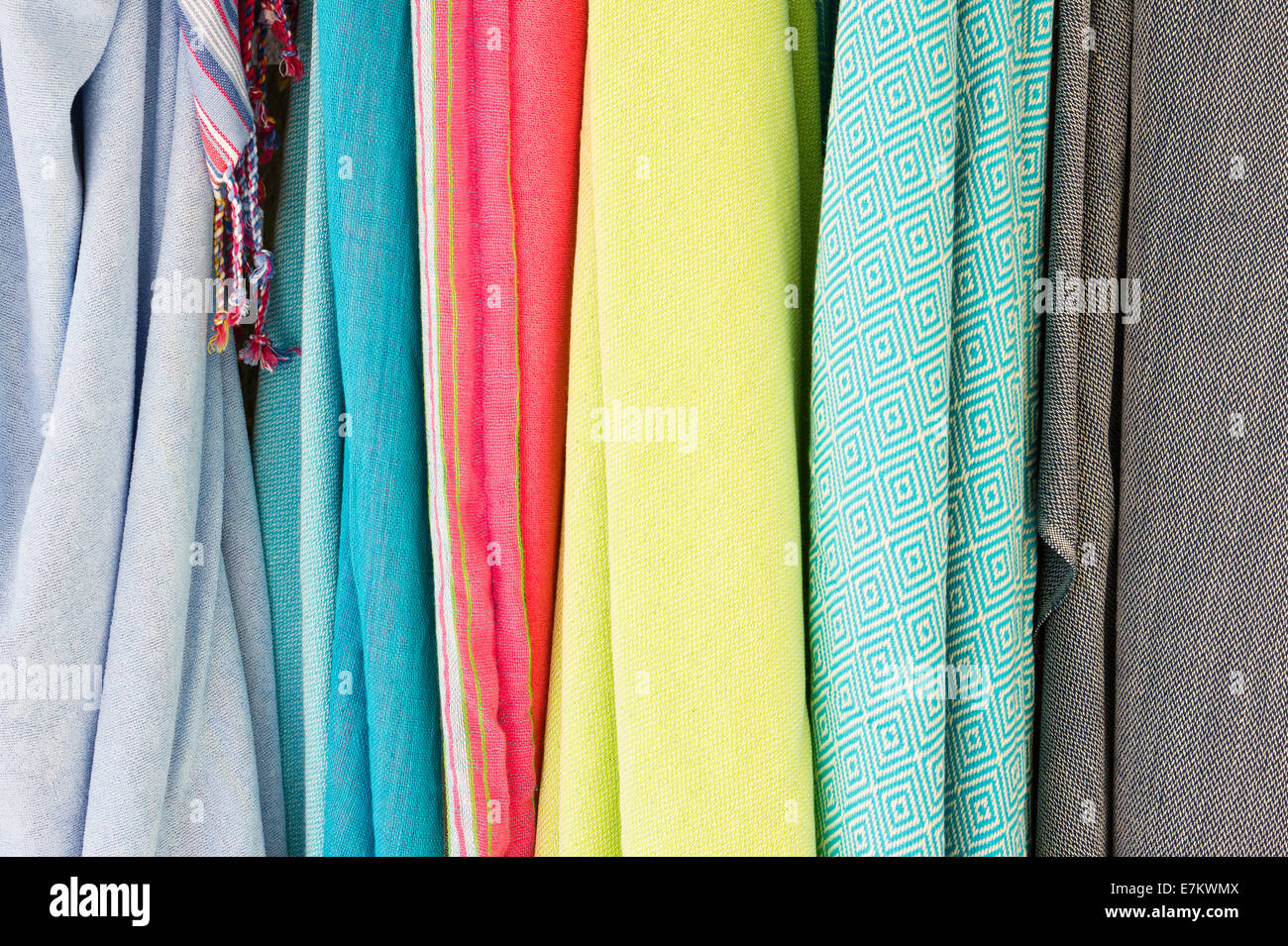 Hanging clothes as a detailed background Stock Photo - Alamy