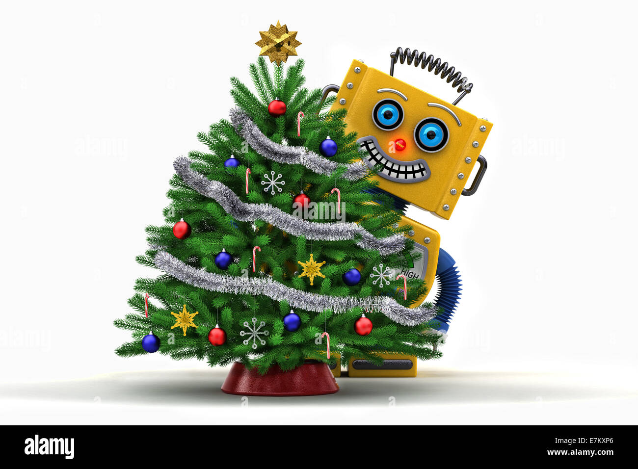 Toy robot standing with christmas tree Stock Photo - Alamy