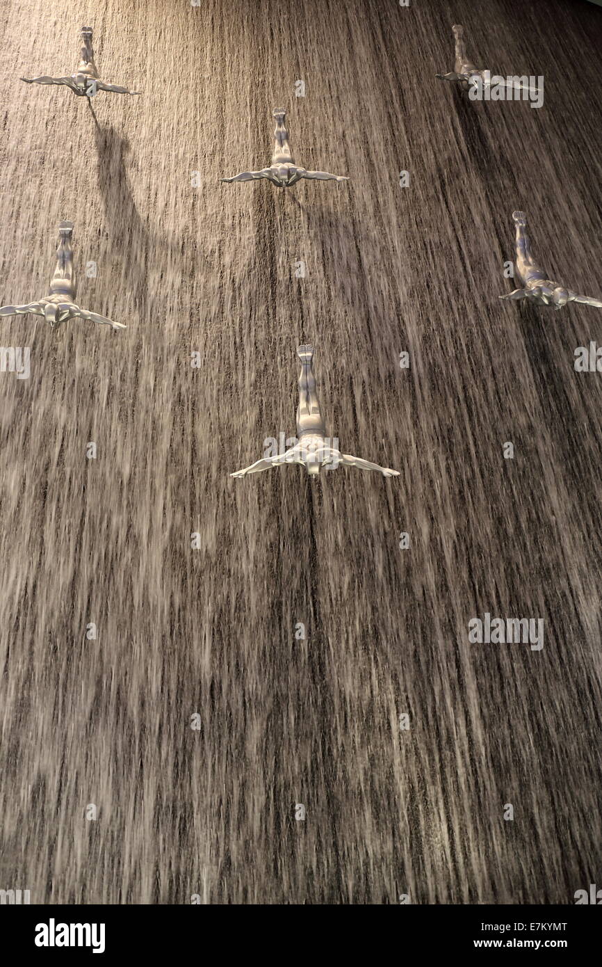 Waterfall with statues of divers in the Dubai Mall, Dubai, United Arab ...