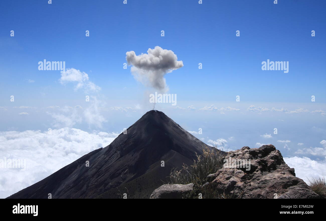 Volcan Fuego (Fire volcano) erupts a cloud of ash and smoke near ...
