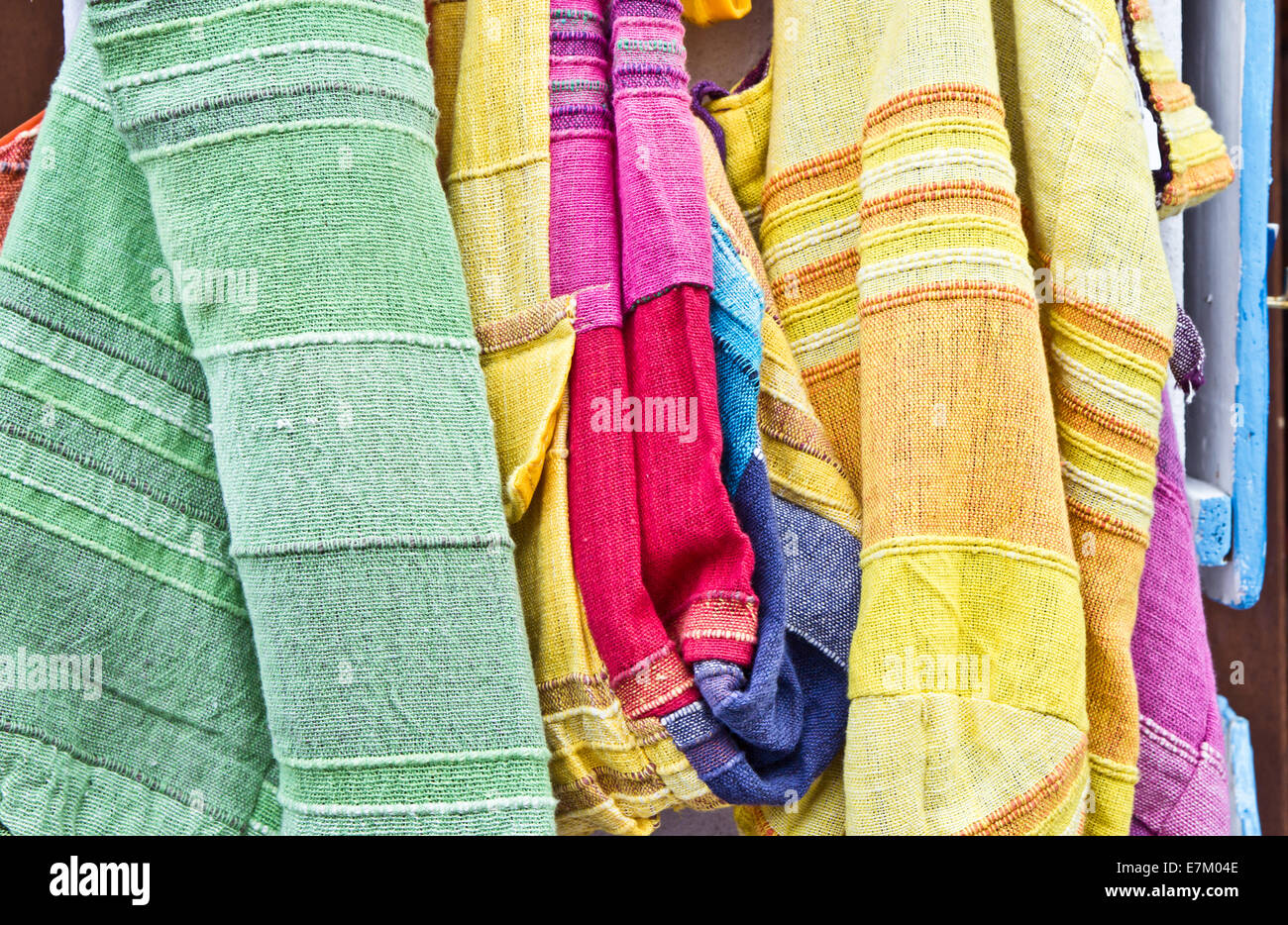 Selection of bright cloths as a background Stock Photo - Alamy