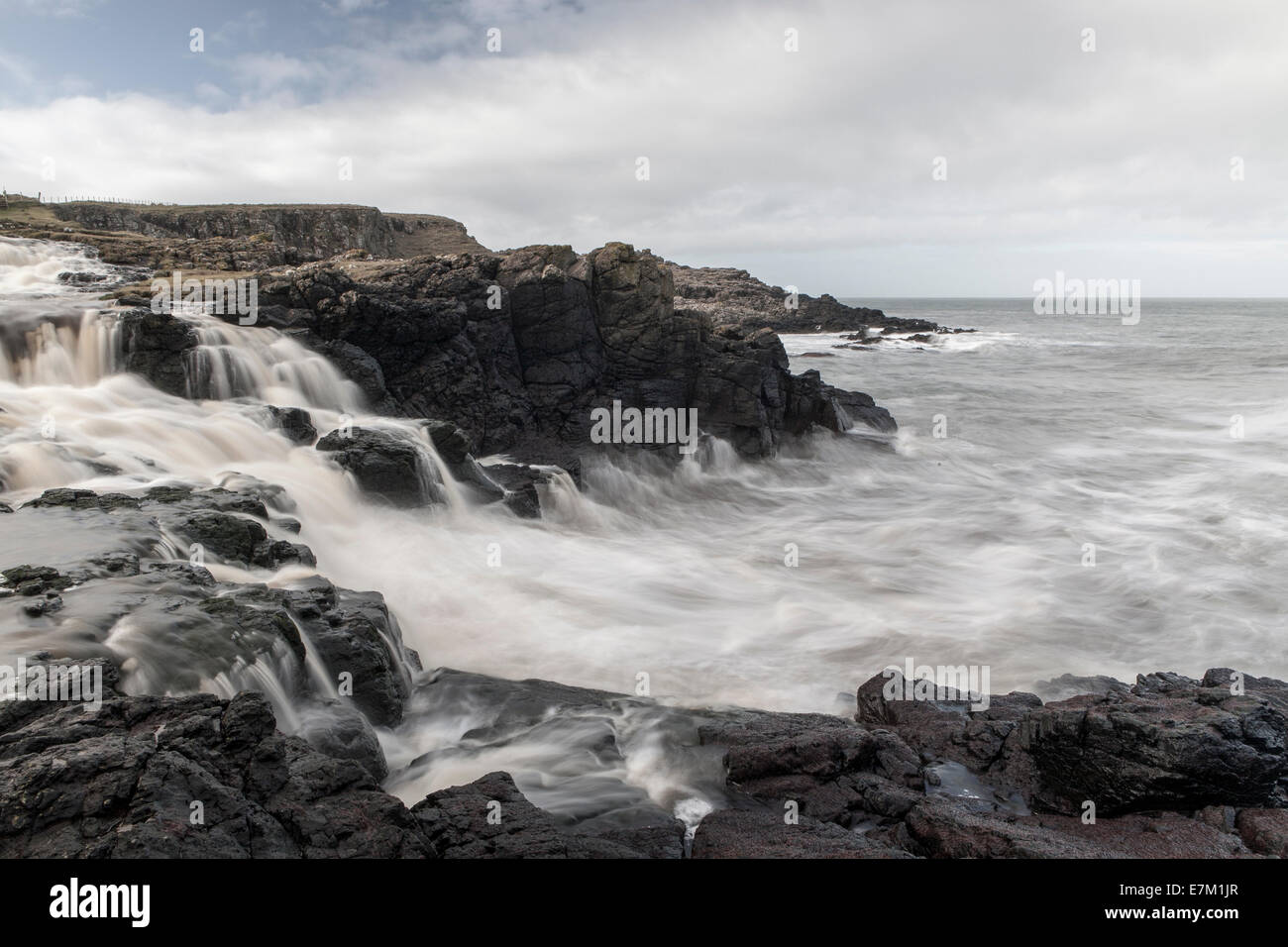 Waterfall meets the sea Stock Photo - Alamy