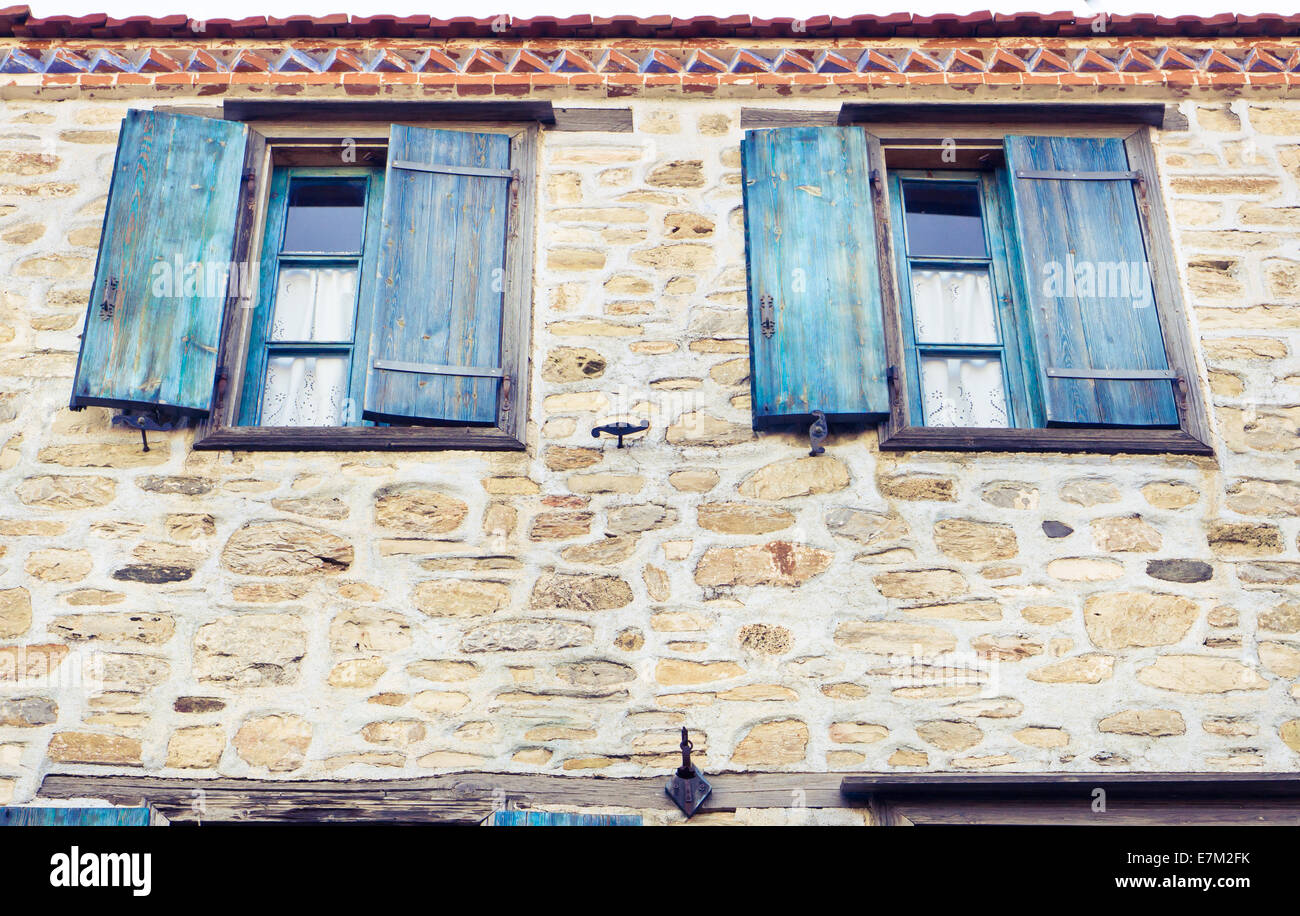 Two windows with blue wooden shutters in a Greek house Stock Photo - Alamy