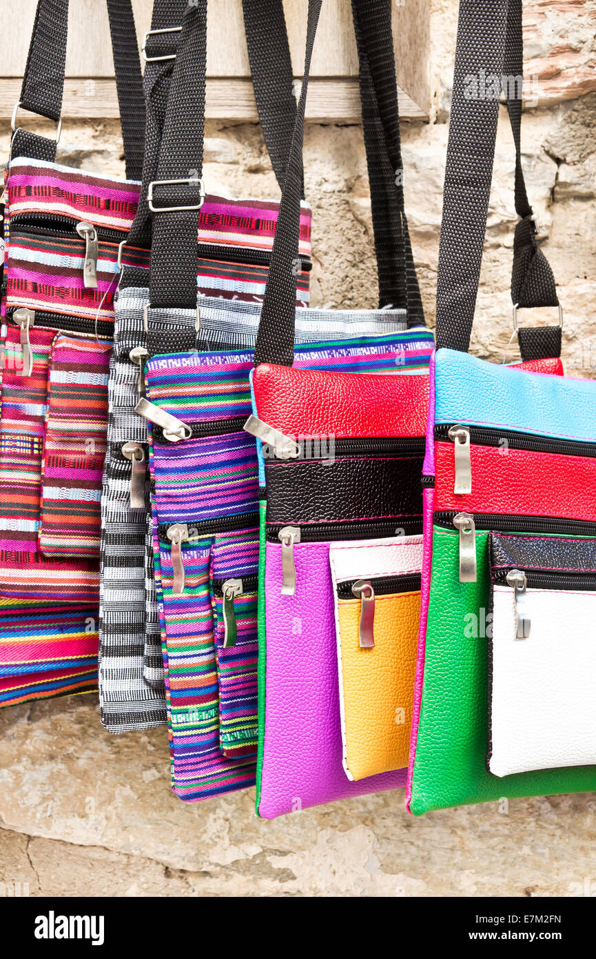 Colorful hand made bags on sale at a market Stock Photo - Alamy