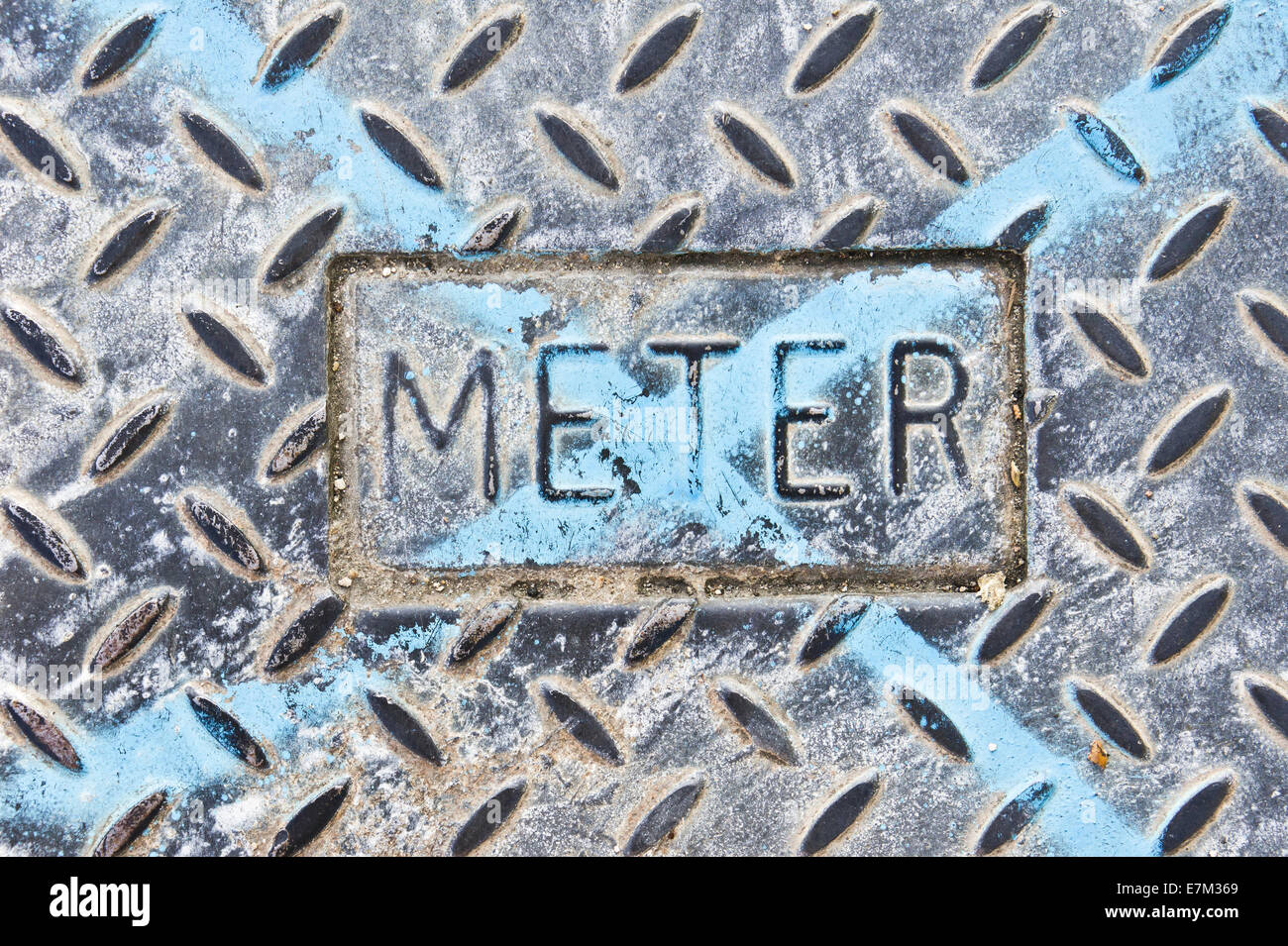 Metal cover of a water meter Stock Photo - Alamy