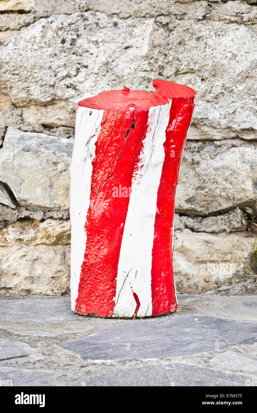 A red and white painted wooden log Stock Photo - Alamy