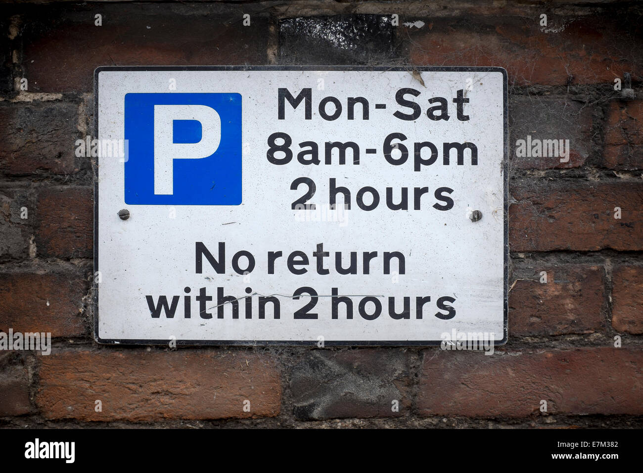 Parking Sign with Timings Stock Photo - Alamy